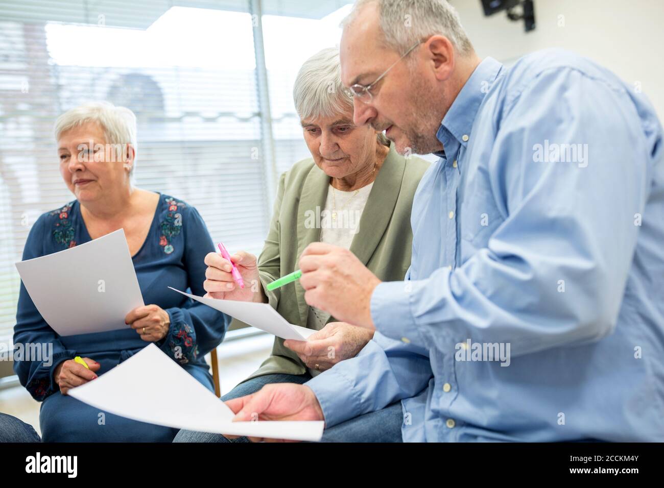 Group therapy men and women reading and writing hi-res stock ...