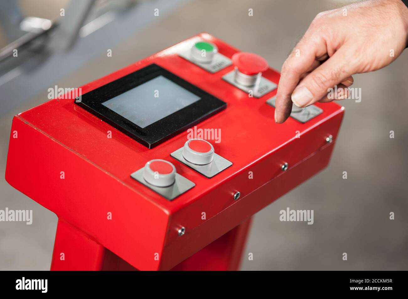 Industrial machinery mechanics and factory worker adjusts industry ...