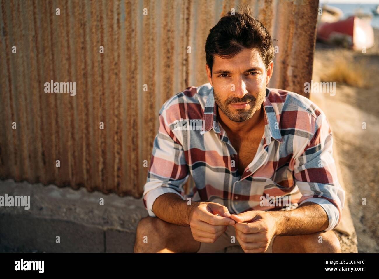 Man Sitting Against Wall High Resolution Stock Photography and Images ...