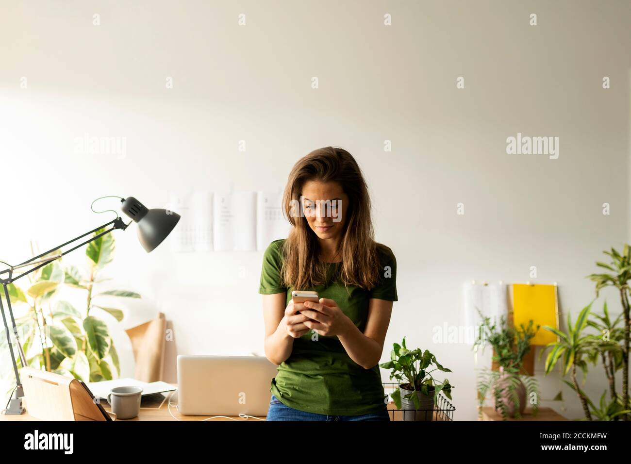 Woman using standing desk hi-res stock photography and images - Alamy