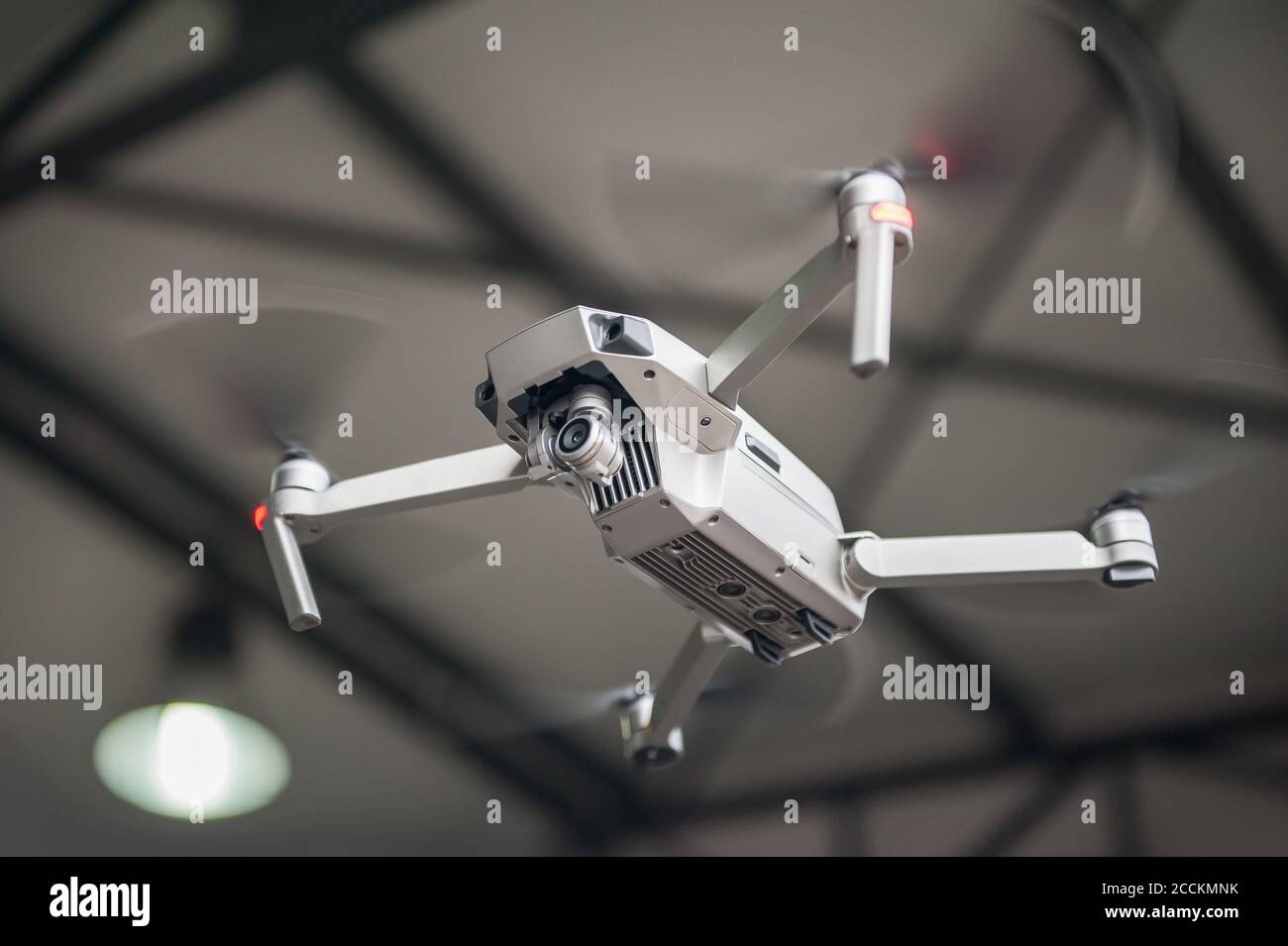 Uav drone copter flying with high resolution digital camera. Close up ...
