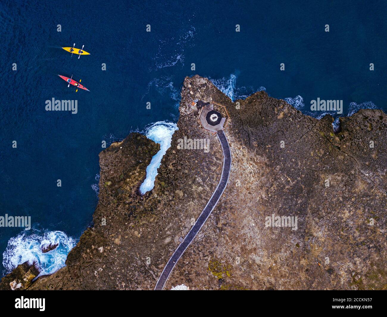 Indonesia, Bali, Nusa Dua, Aerial view of people kayaking near rocky ...
