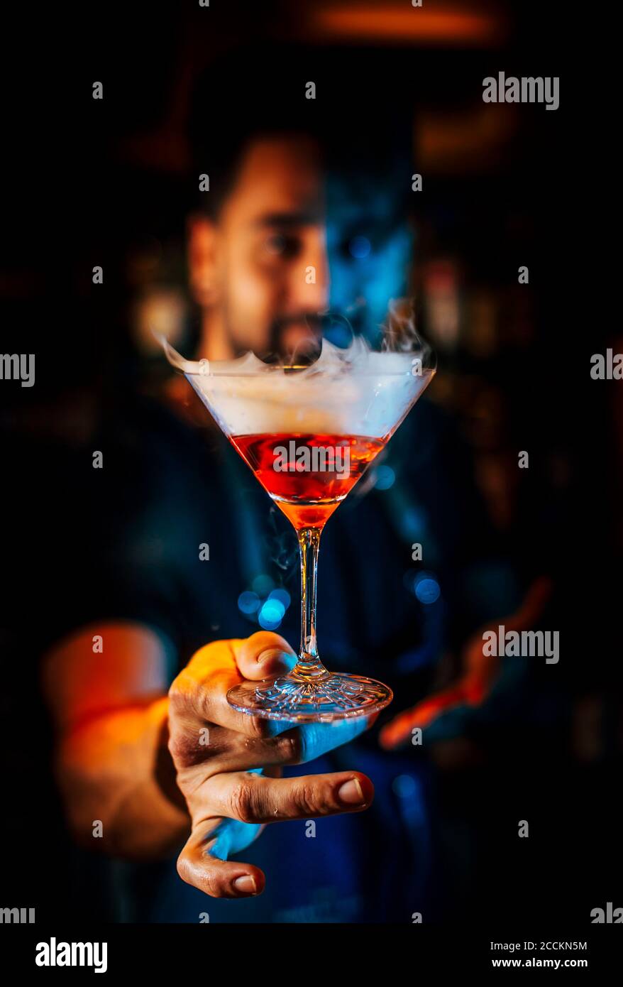 Close-up of male bartender holding cocktail in nightclub Stock Photo ...