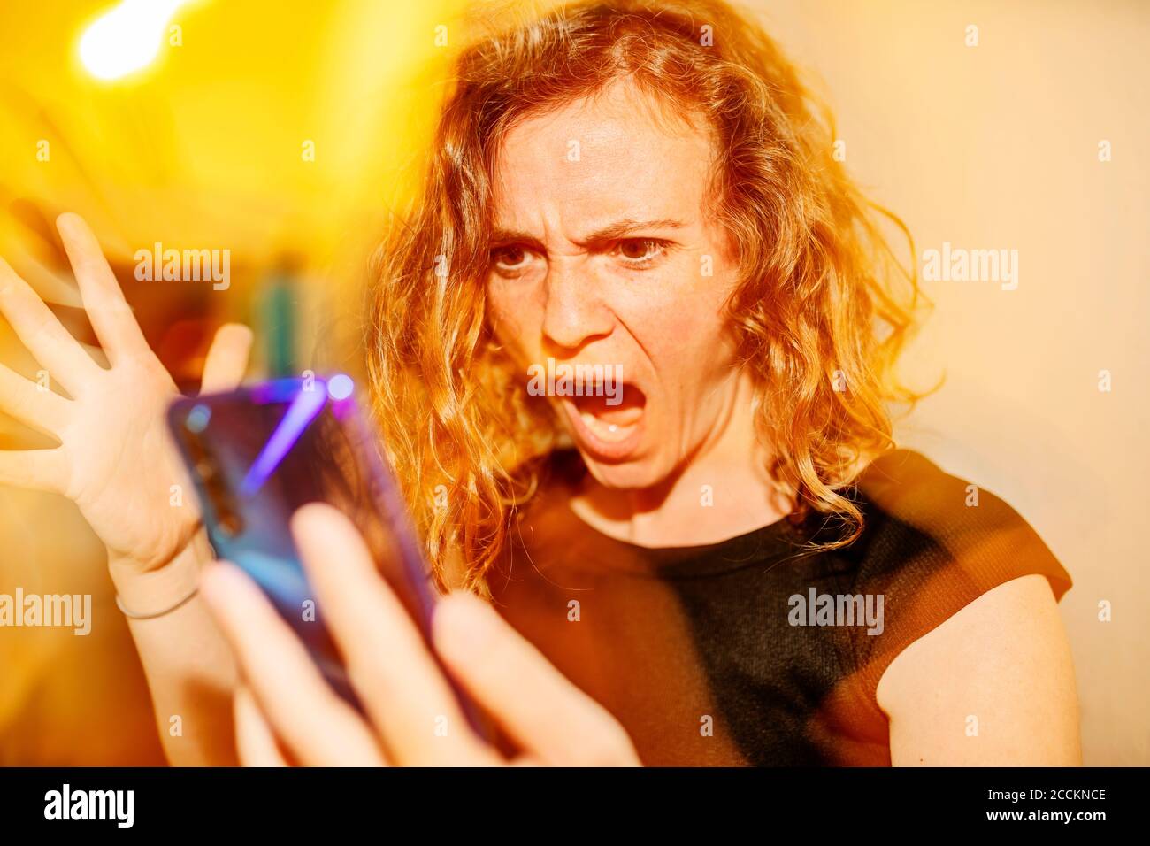 Woman phone call angry hi-res stock photography and images - Alamy