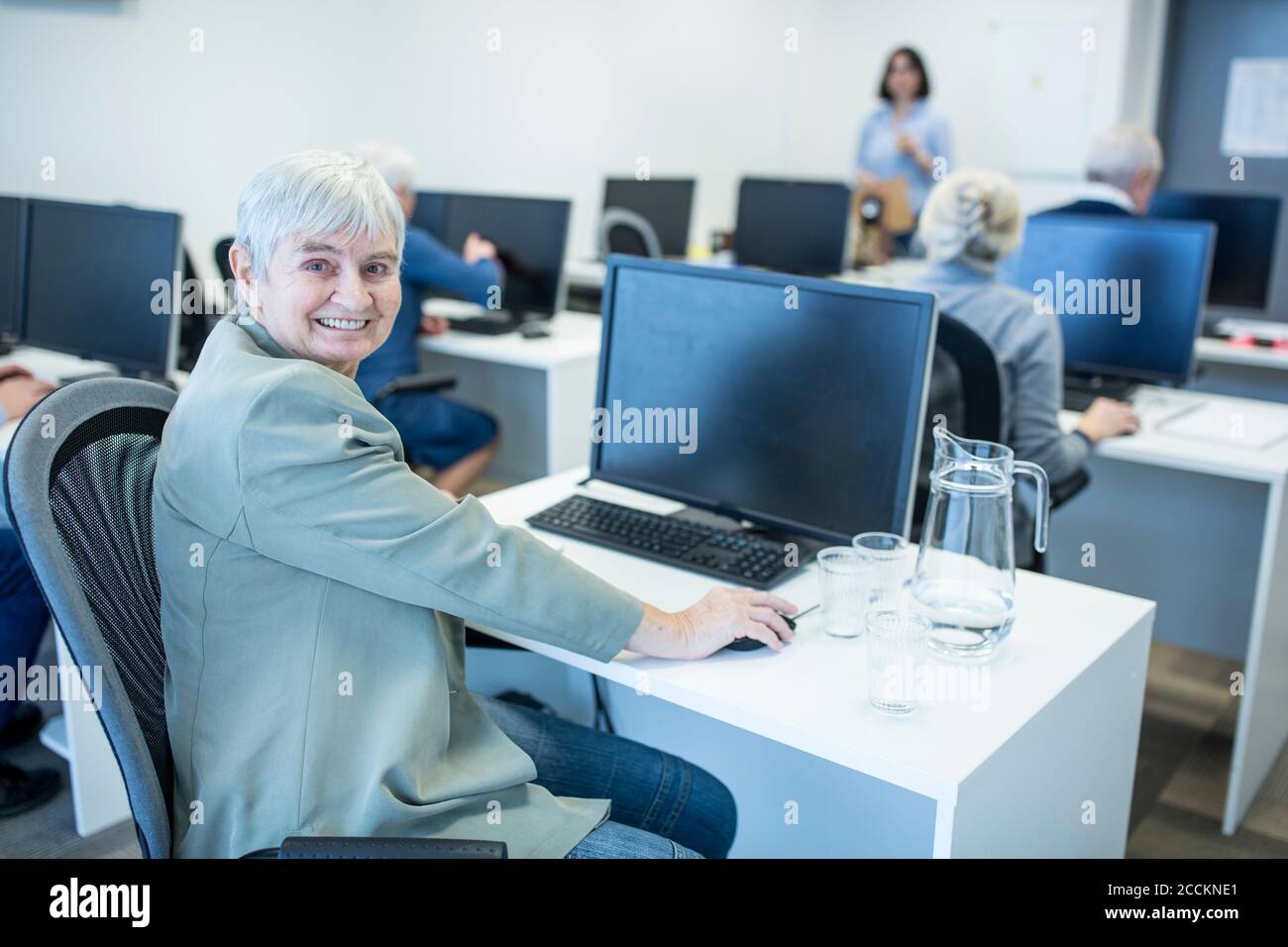 Senior man attending computer course hi-res stock photography and ...