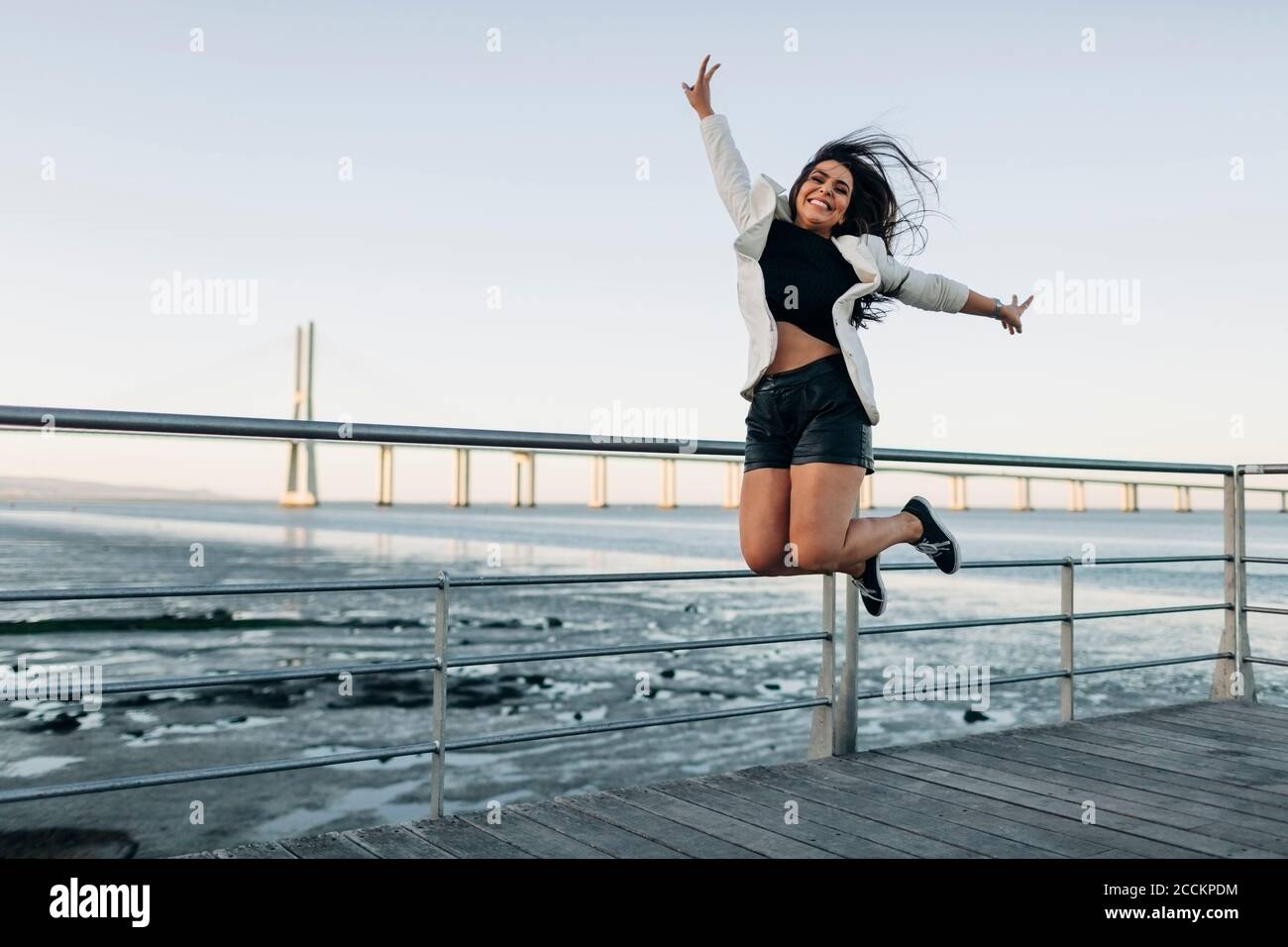 Young woman jumping water hi-res stock photography and images - Alamy