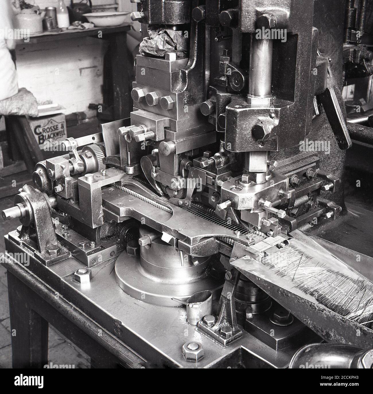 1950s, historical, heavy engineering machine tool for making steel pins ...