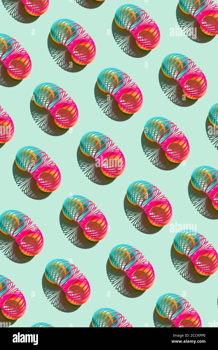 Pattern of rows of plastic Slinky springs Stock Photo - Alamy