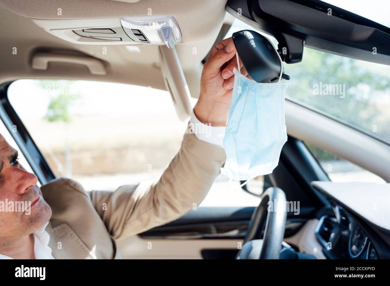 Man taking off mask hi-res stock photography and images - Alamy