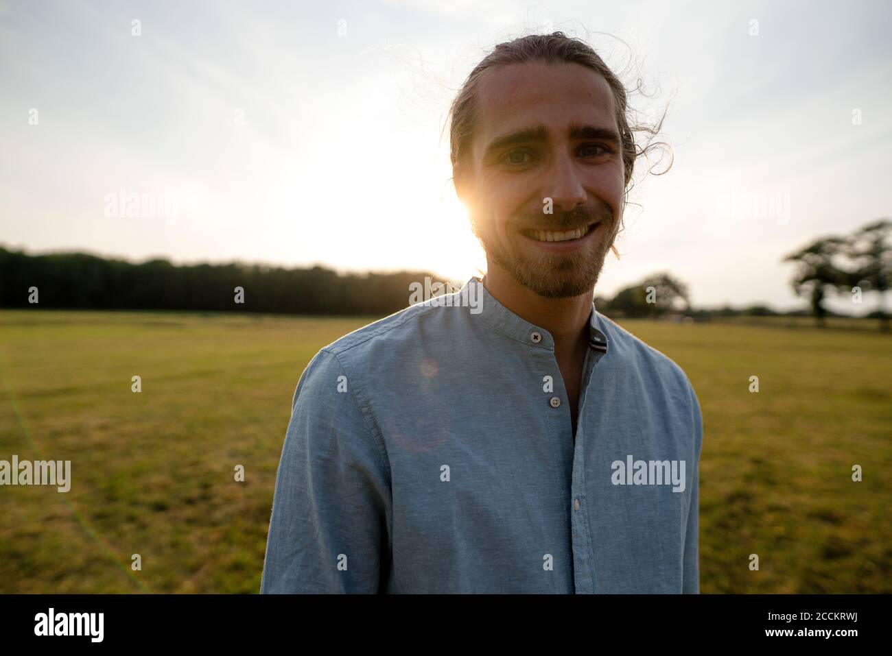 Young happy man in evening hi-res stock photography and images - Alamy