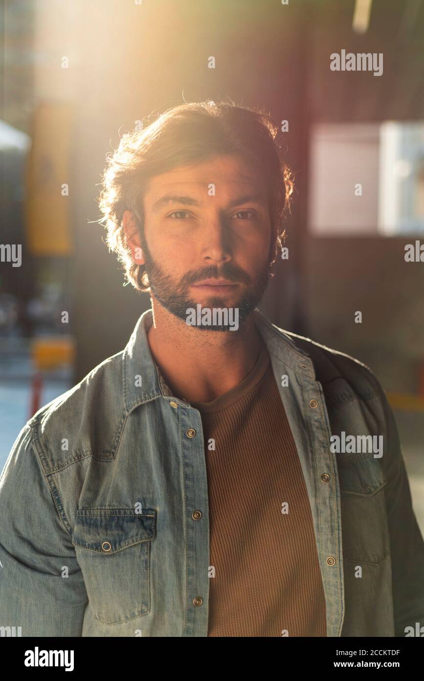 Close-up of handsome mid adult man standing in city on sunny day Stock ...