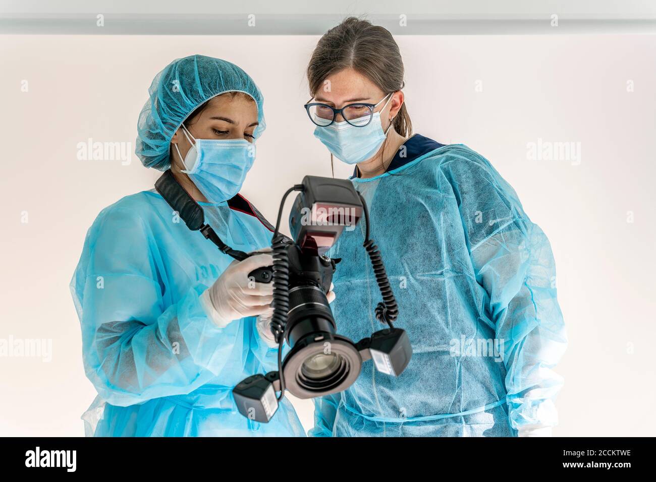 Female doctor and nurse looking at camera in dentist's clinic Stock ...