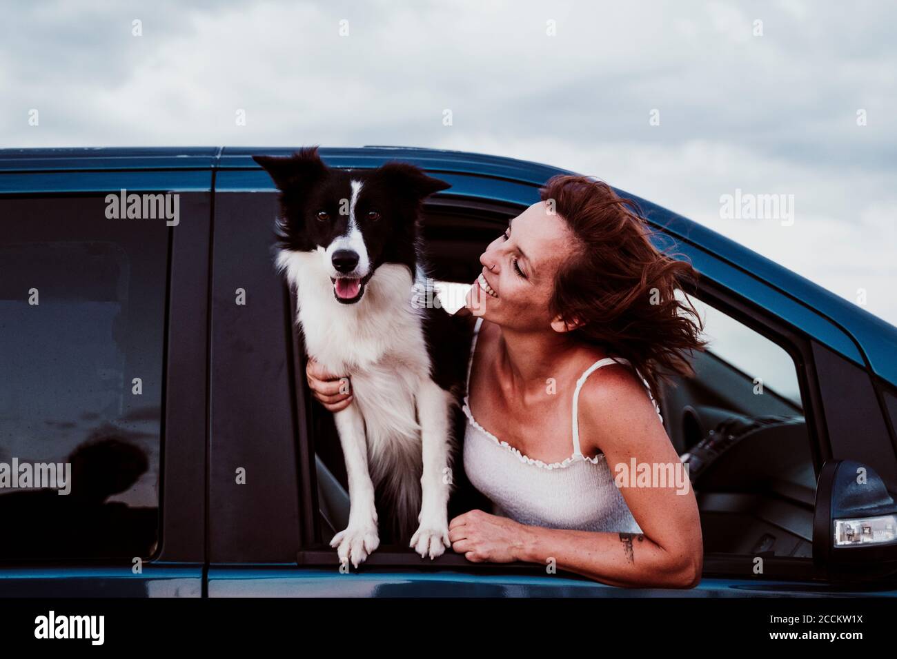 Women looking through window hi-res stock photography and images - Alamy