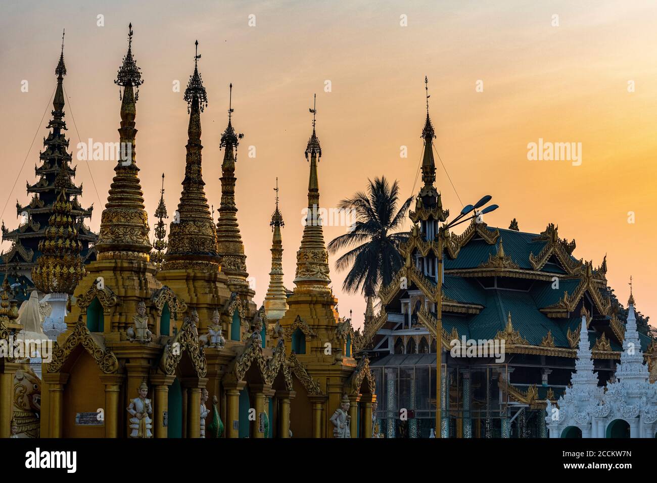 Myanmar, Yangon, Golden spires of Shwedagon pagoda at sunset Stock ...