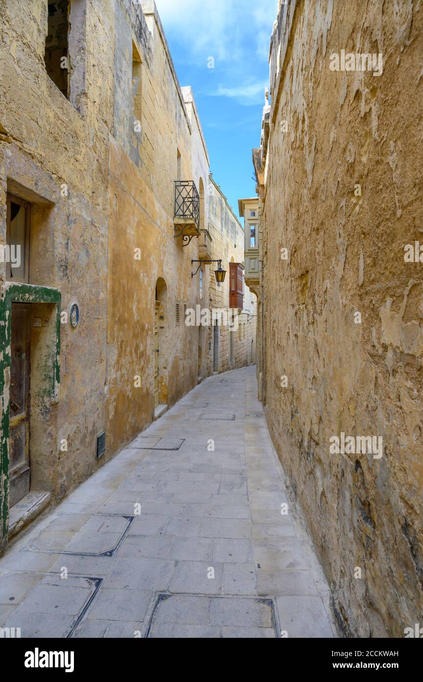 Narrow street in the ancient Maltese city of Mdina on the island of ...