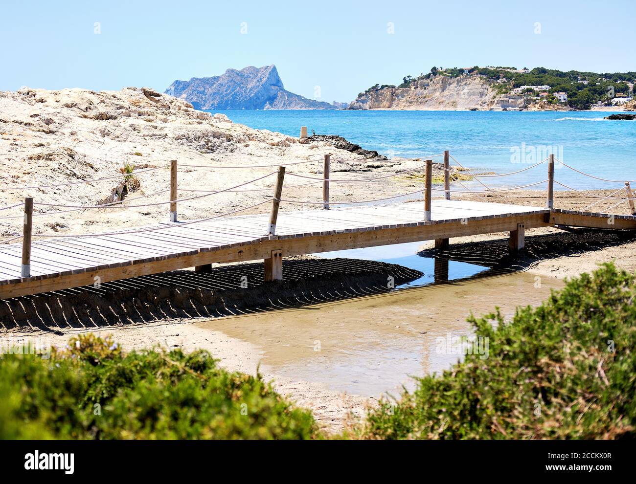 Beach of Moraira during sunny summer day, spanish coastal town. Spain ...