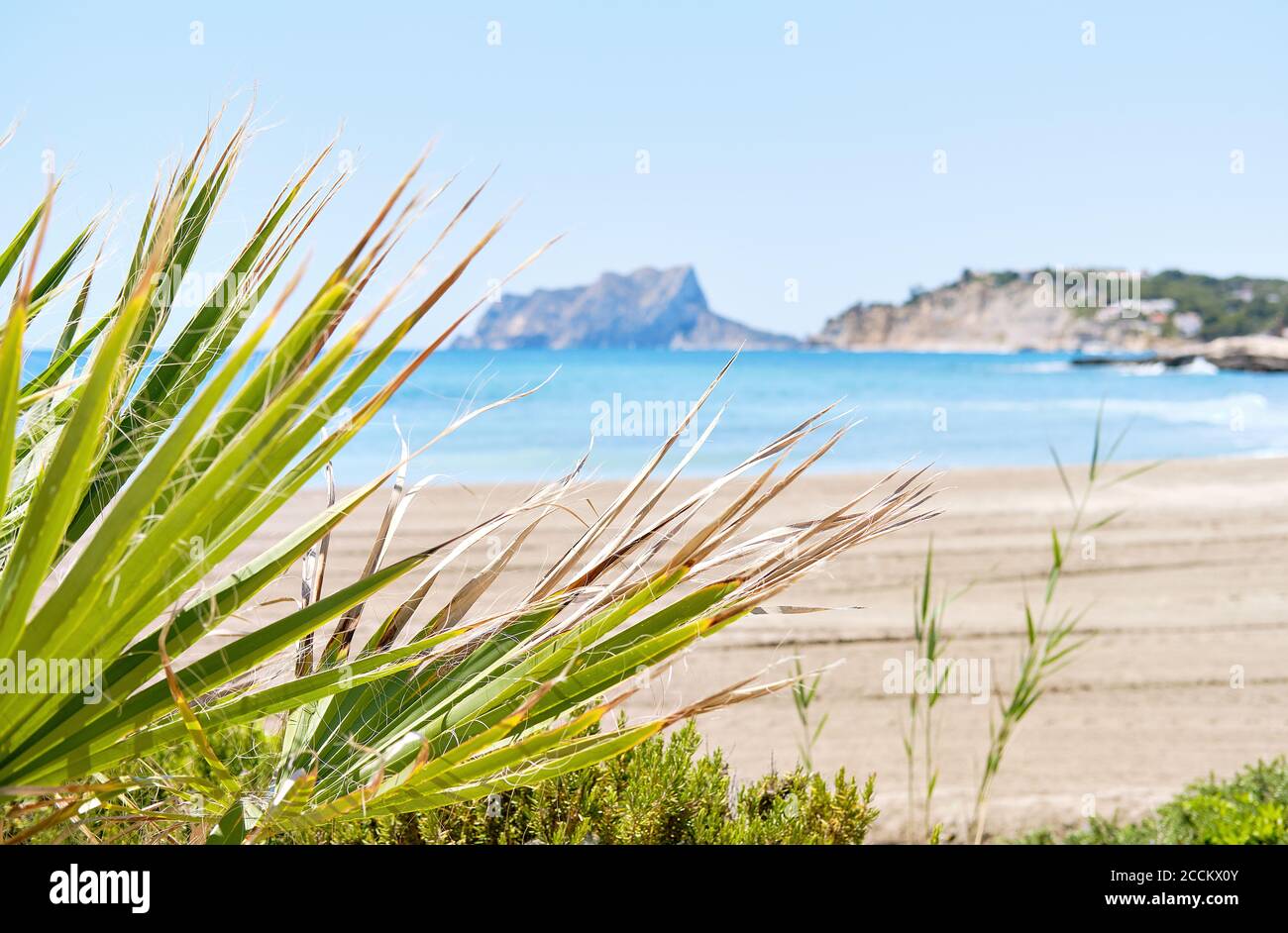 Beach of Moraira during sunny summer day, spanish coastal town. Spain ...