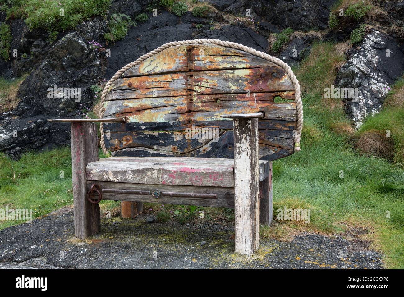 Resting bench made of ship's timber and rope, seen at Mullion Harbour ...