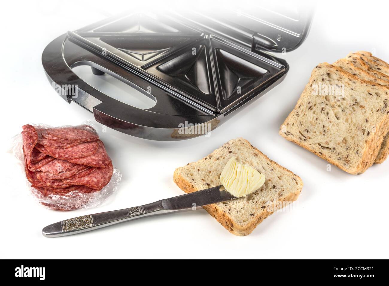 Slice sandwich toaster on a white background Stock Photo - Alamy
