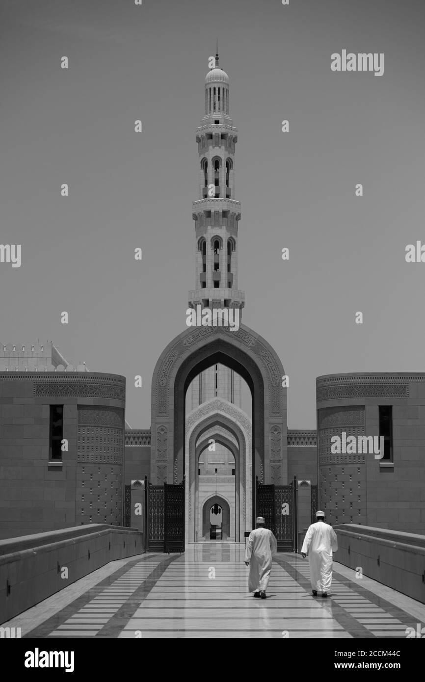 Vertical grayscale shot of the minaret of the Sultan Qaboos Grand ...