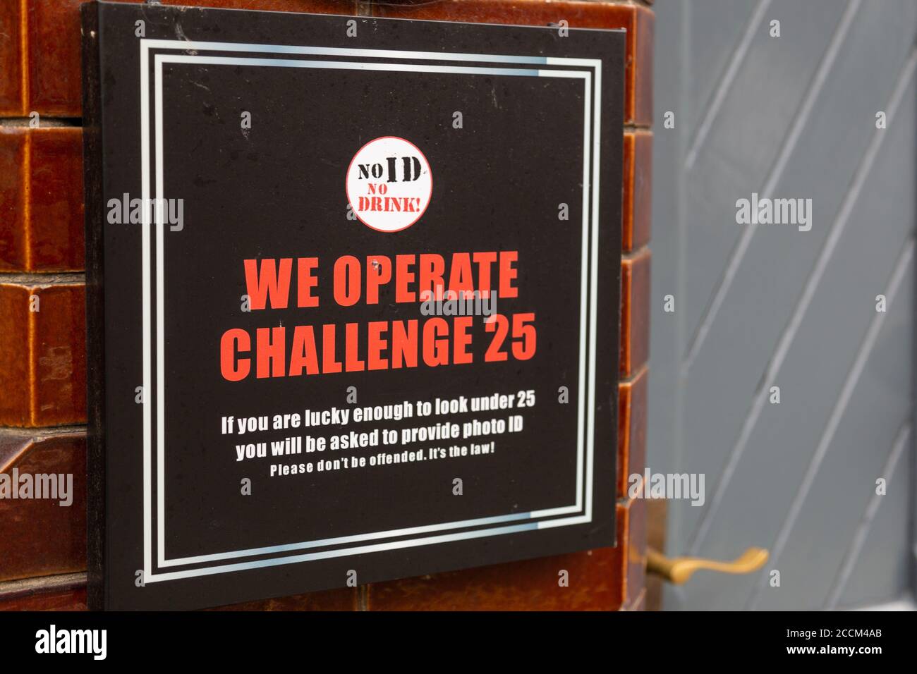 A sign outside a pub showing that they operate a challenge challenge 25 ...