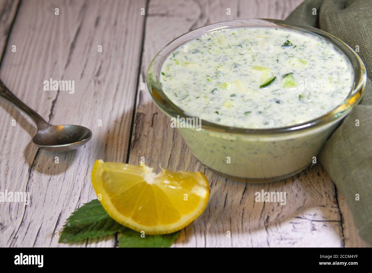 The sauce consists of kefir, green cucumber and lemon. A dish of ...