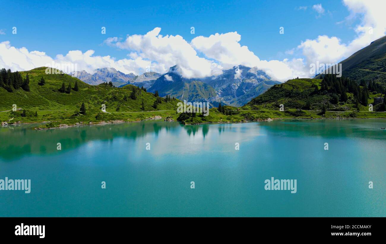 Flight over a wonderful mountain lake in the Swiss Alps - Lake Truebsee ...
