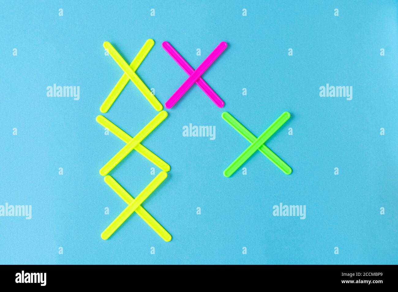 figures from counting sticks in the form of crosses on a blue ...
