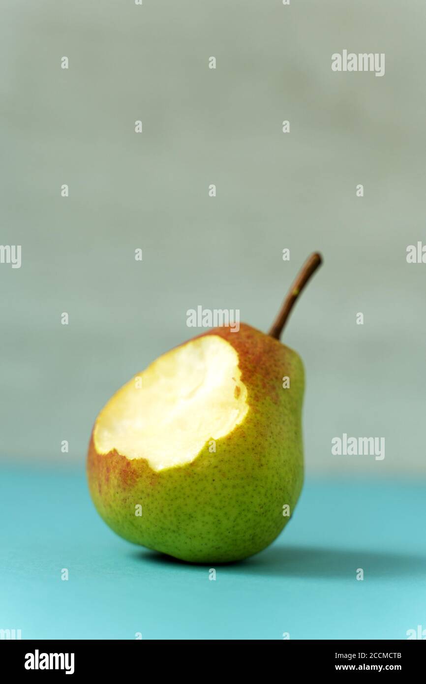 Bitten pear and one full. Isolated on white background Stock Photo - Alamy