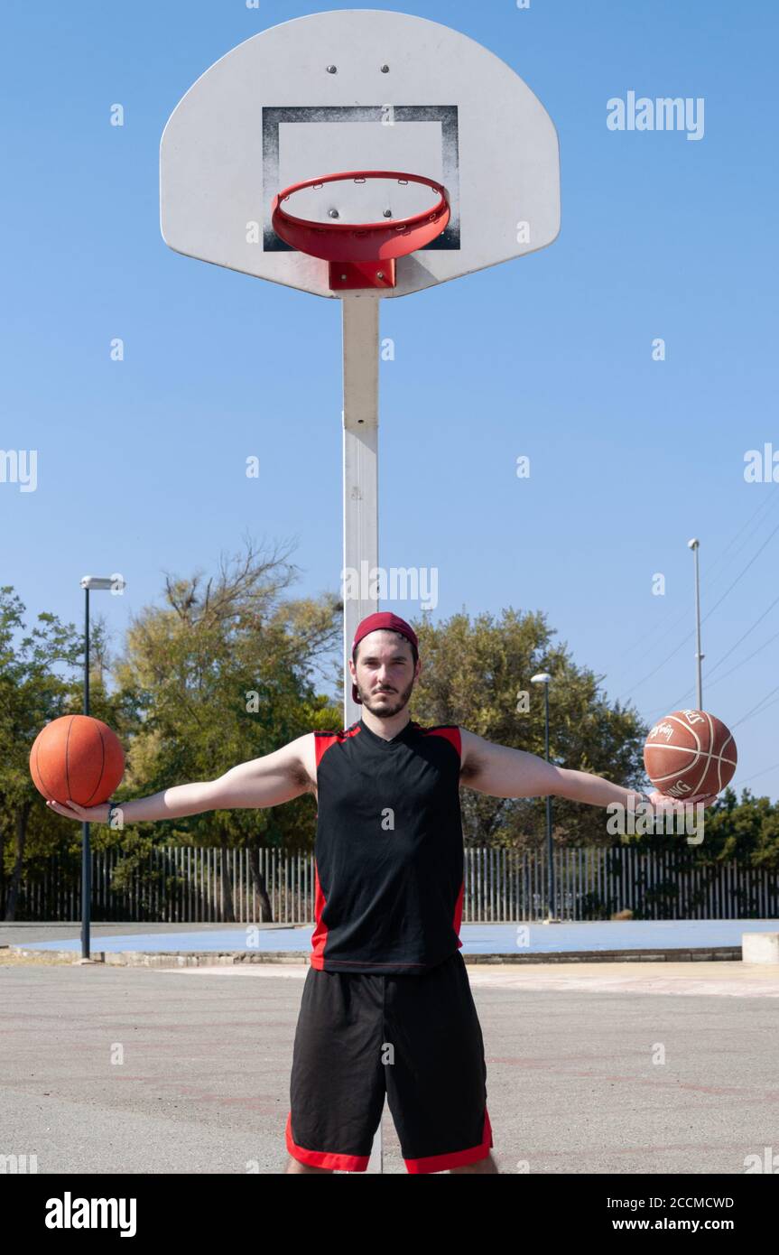 Athletic man holding basketball hi-res stock photography and images - Alamy