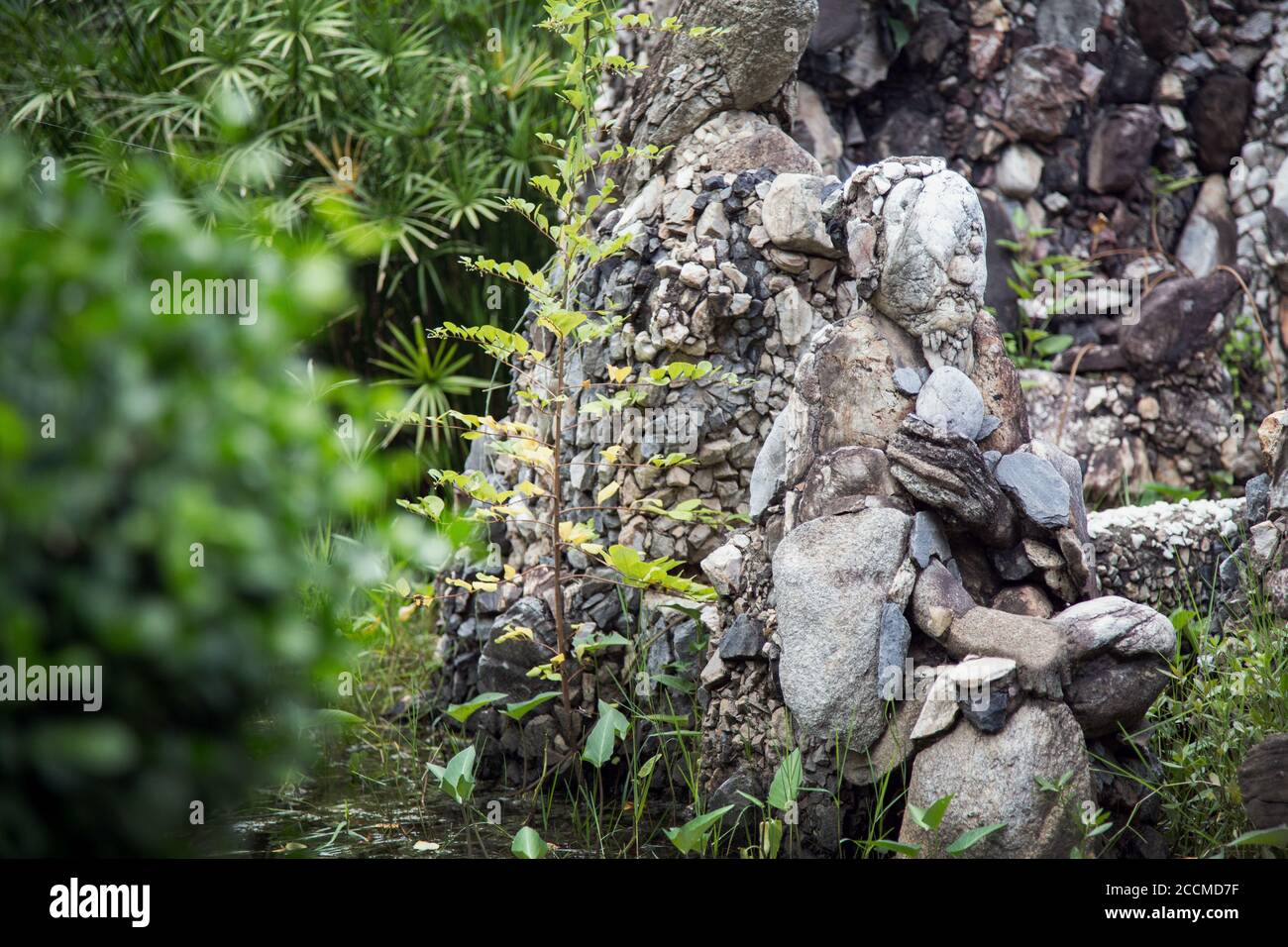 fantastic stone arranging as human shape on sitting action Stock Photo ...