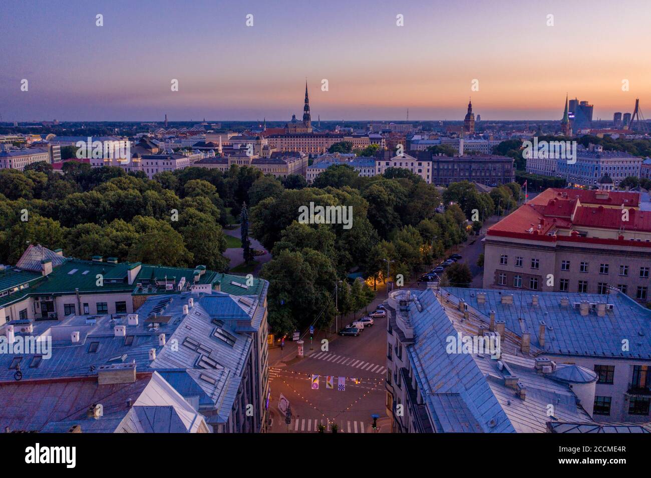 Cityscape of Riga surrounded by buildings and greenery during the ...