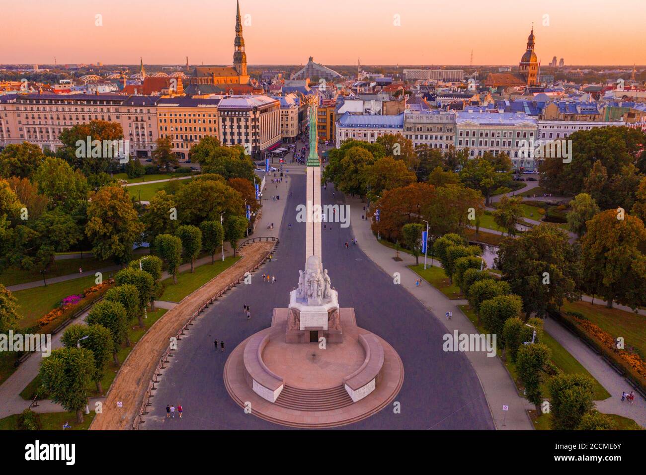 Freedom Square surrounded by buildings and greenery during the sunset ...
