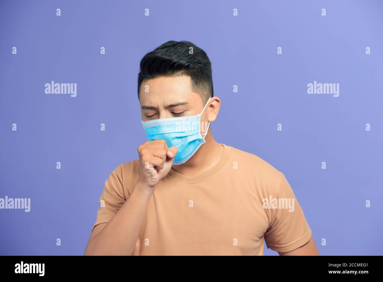 Asian man wearing a face mask with coughing Stock Photo - Alamy