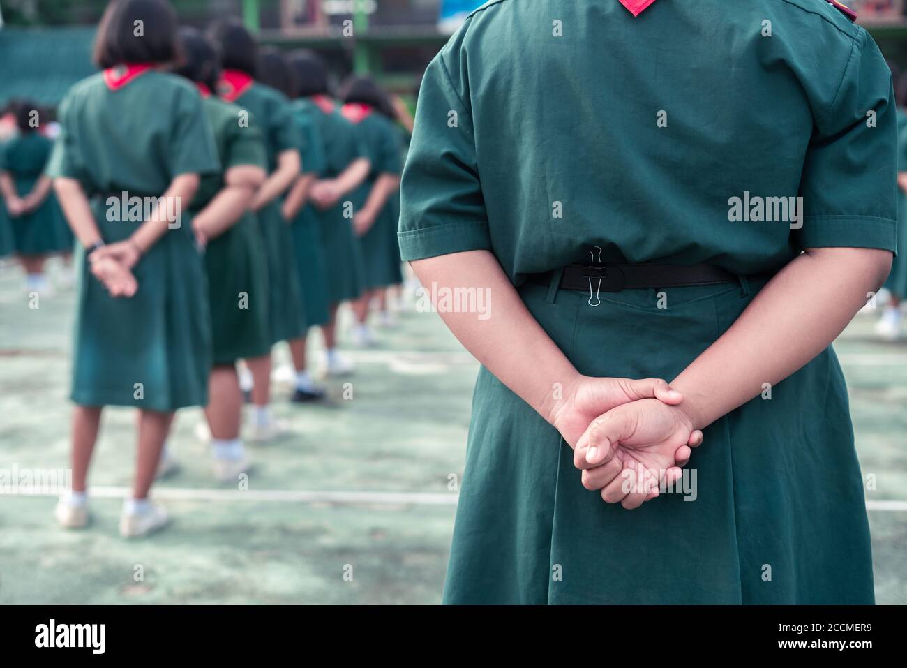 Uniform scout stands with his hands behind his back at the school Stock ...