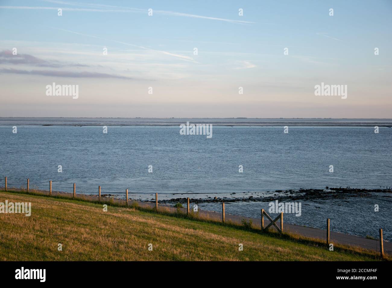 Beautiful shot of sea water near a park on a gloomy day Stock Photo - Alamy