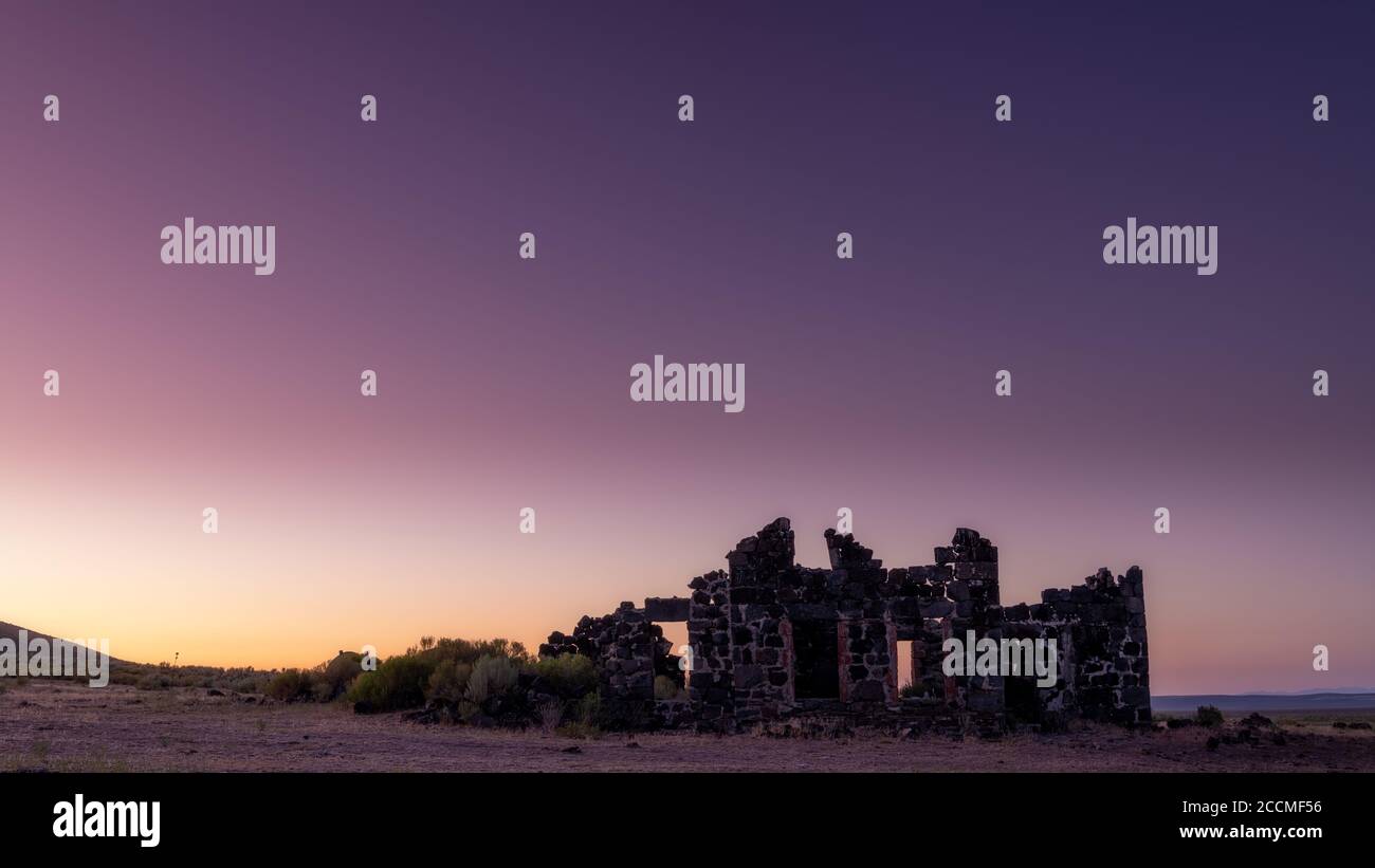 Rainbow colors in the sunsetting sky above ruins in the desert Stock ...