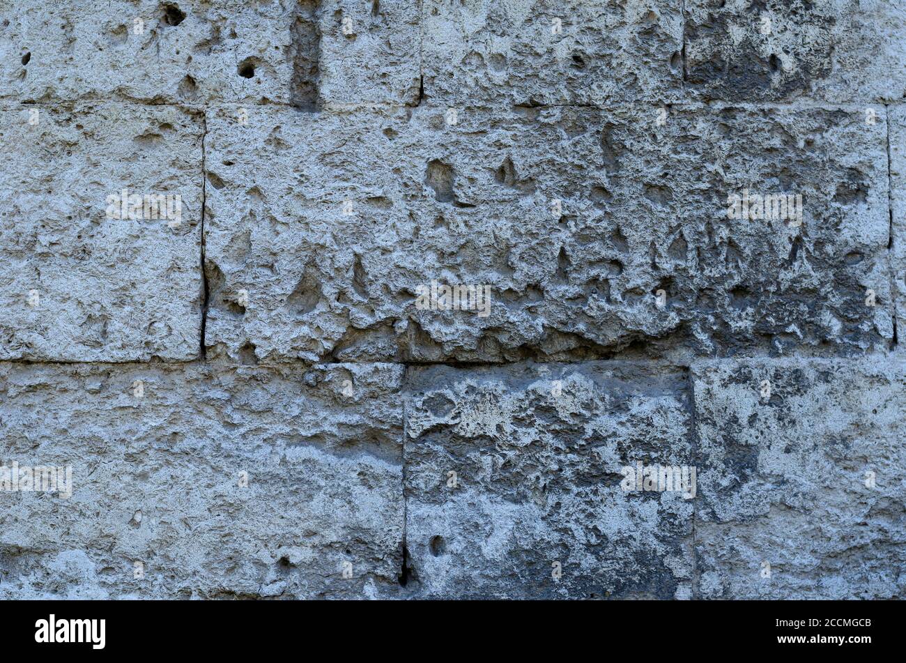 Antique shell stone exterior wall. Close-up of building blocks with ...