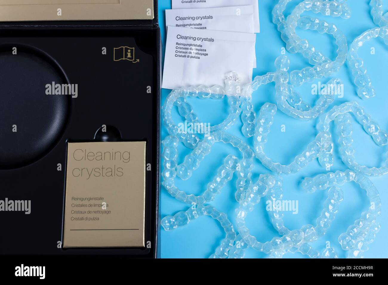 Invisalign transparent brackets package box on blue background with ...