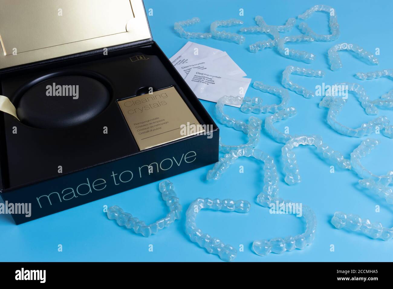 Invisalign transparent brackets package box on blue background with ...