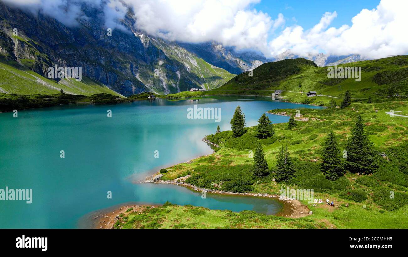Flight over a wonderful mountain lake in the Swiss Alps - Lake Truebsee ...