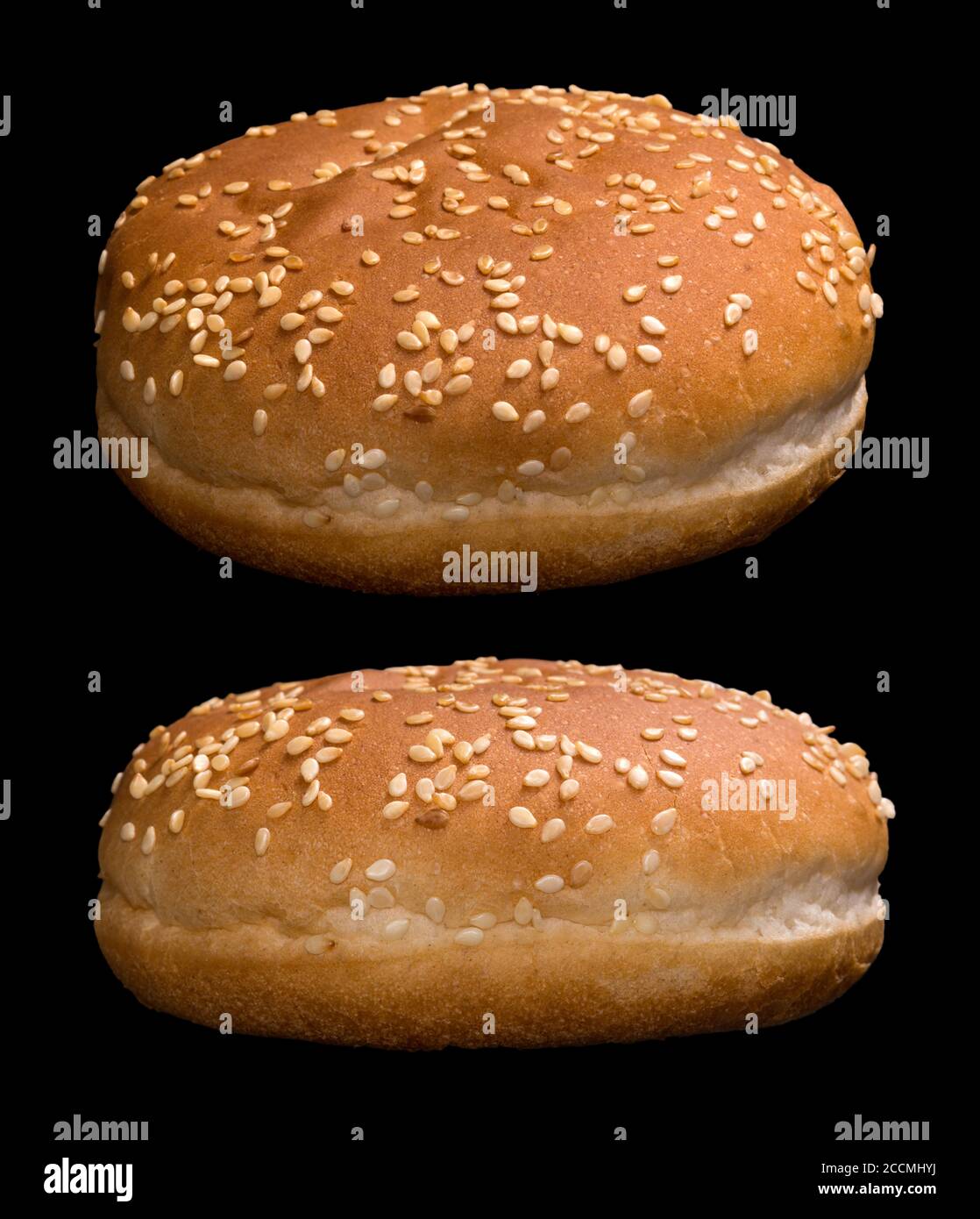 Two burger buns isolated on black background Stock Photo - Alamy