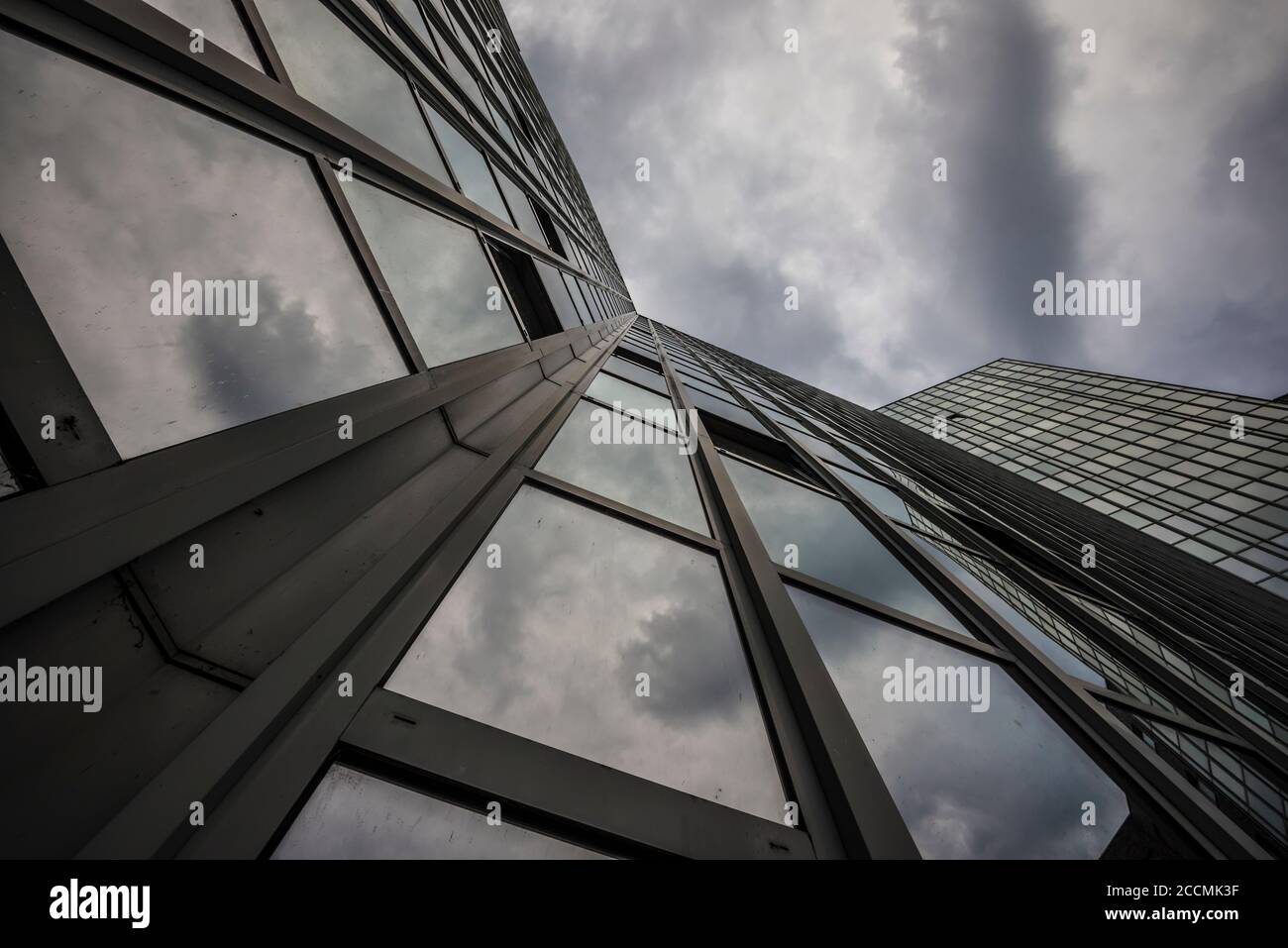 modern office building with storm clouds Stock Photo - Alamy
