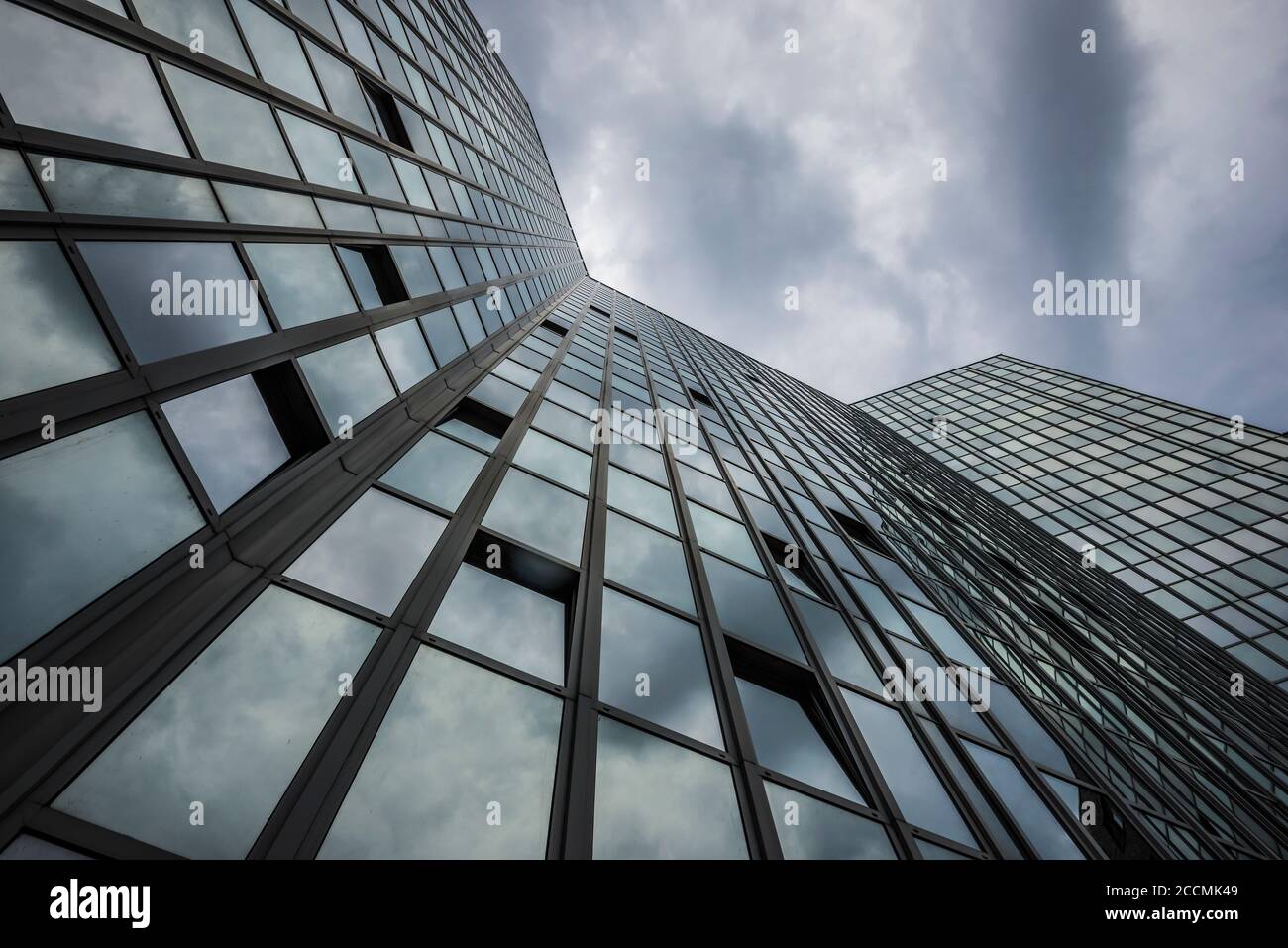 modern office building with storm clouds Stock Photo - Alamy