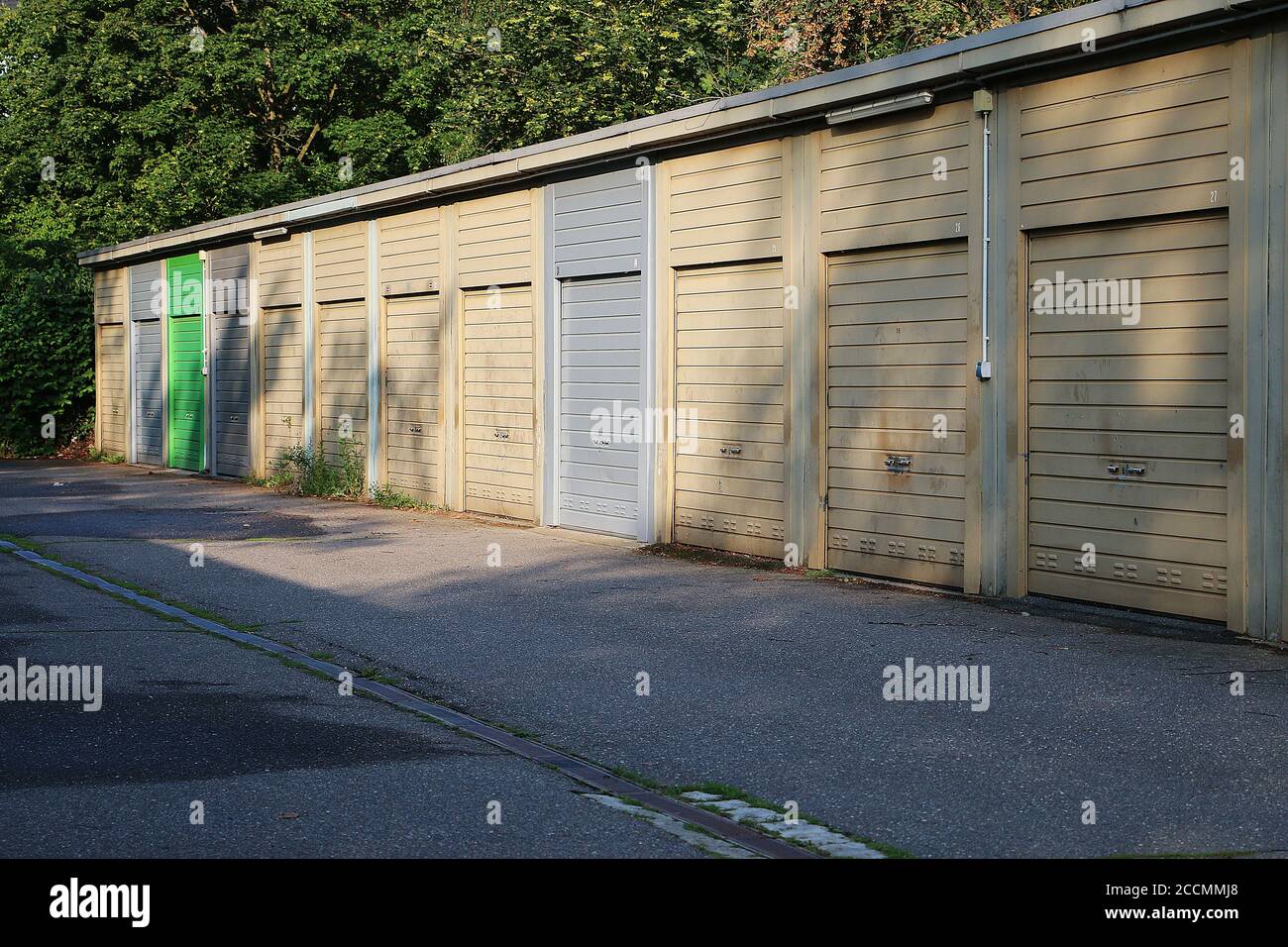 Row of sectional sliding garage gates Stock Photo - Alamy