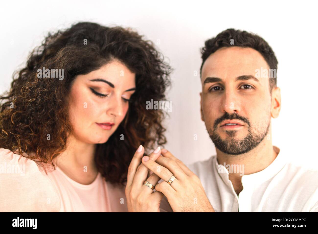 Young couple in love touching their hands with engagement rings. Couple ...