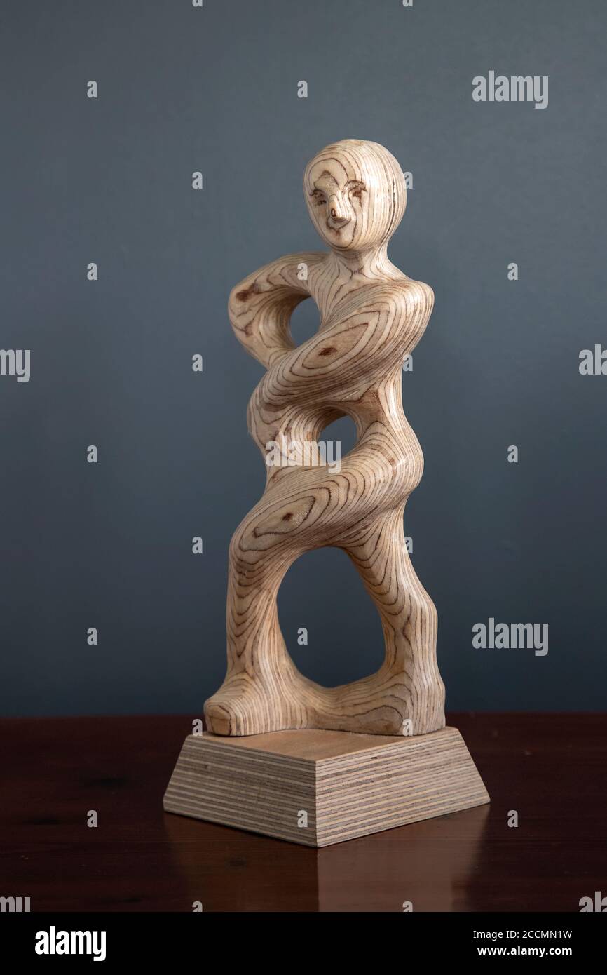 Figurative artistic wood carving from plywood of a person mounted on a ...