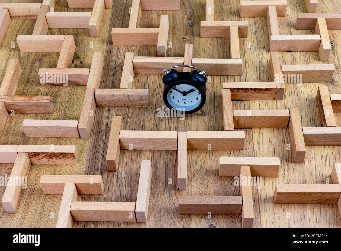 business concept, wooden maze model with clock in the center Stock ...