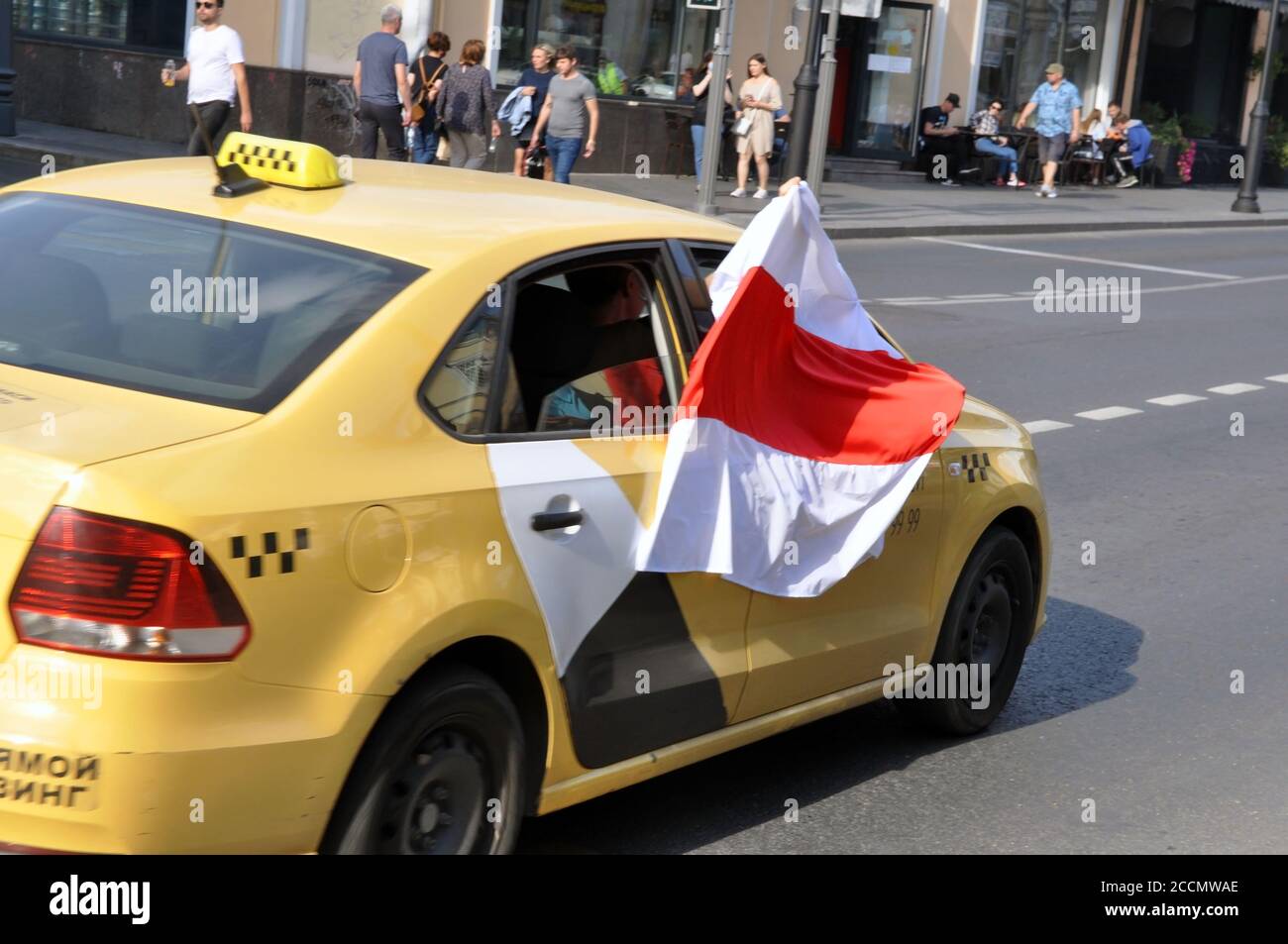 National flag from the window of a taxi car during a protest rally in ...