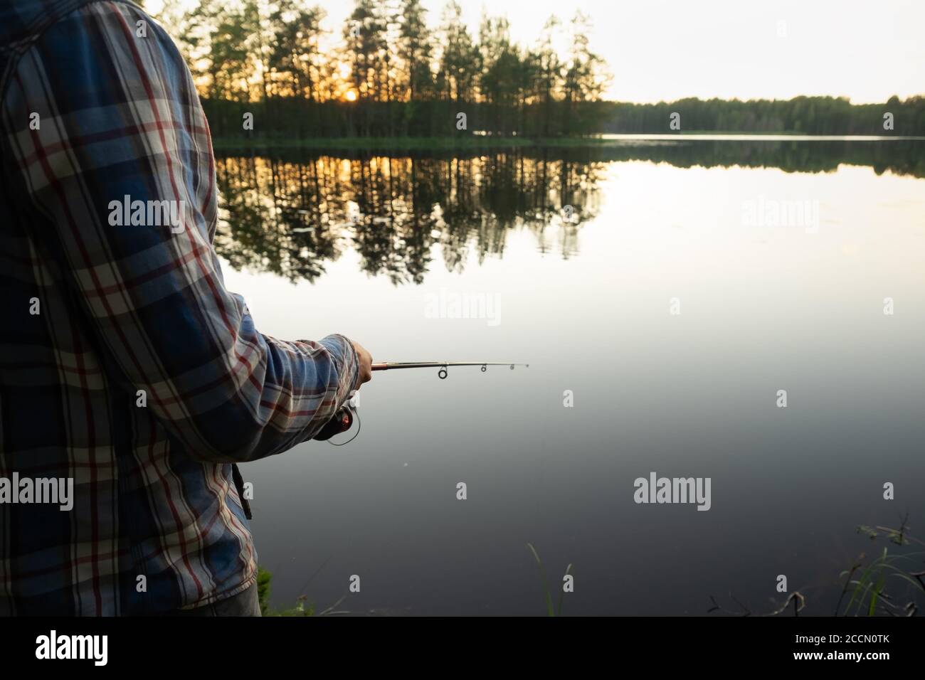 Fisherman fishing rod on lake hi-res stock photography and images - Alamy